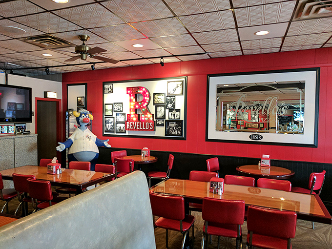 Red booths, wood paneling, and walls adorned with memorabilia create the perfect backdrop for the serious business of pizza enjoyment.