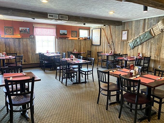 Empty tables that won't stay that way for long. The wooden paneling and warm lighting create the perfect backdrop for imminent food comas.