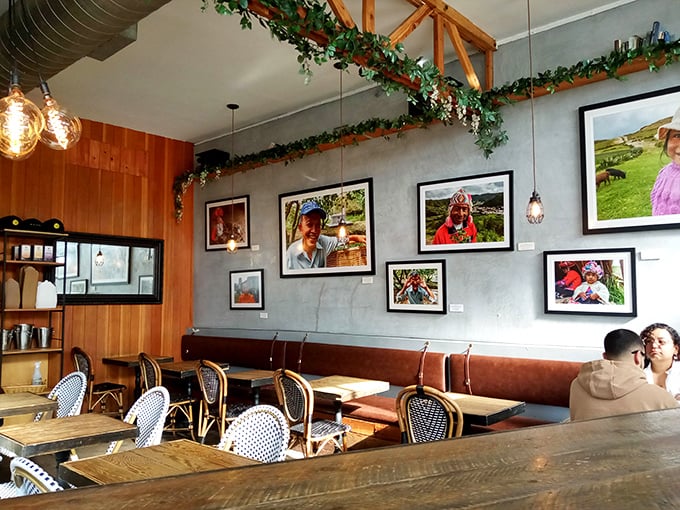 Wooden tables, bistro chairs, and framed photography create a space that feels like your coolest friend's dining room.