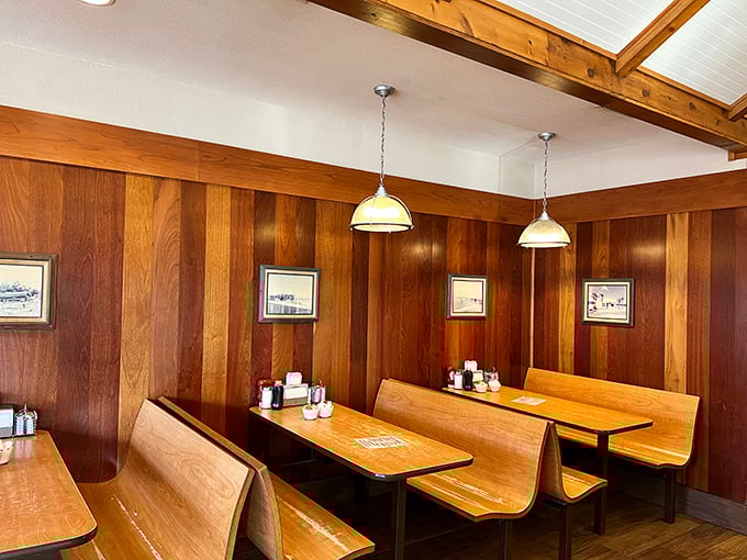 These wooden booths have witnessed countless vacation plans, business deals, and first dates. If they could talk, they'd probably just say "order the omelet."