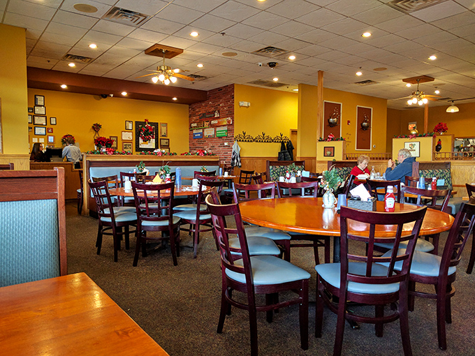 The dining room hums with conversation and clinking silverware. Yellow walls and wooden accents create that "everybody knows your name" vibe.