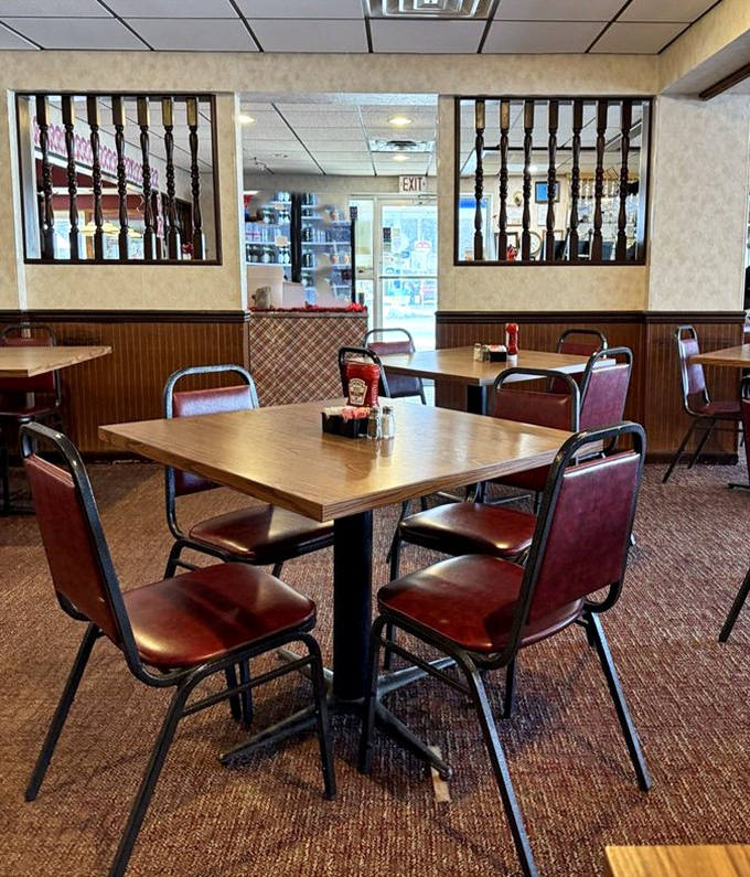 The dining area speaks volumes &ndash; simple tables, practical chairs, and dividers that say, "We've been doing this right since before you were born."