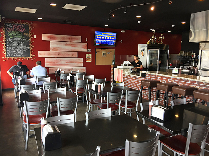 Simple tables, red walls, and the promise of meat. The dining area isn't fancy, but it knows exactly what its priorities are&mdash;and so will you.