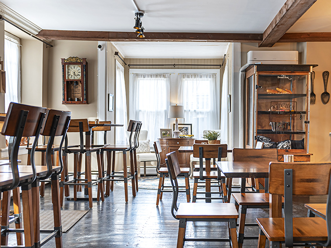 The dining area feels like you've been invited to someone's carefully curated vintage farmhouse. Those wooden beams have witnessed countless "first bite" expressions of pure joy.