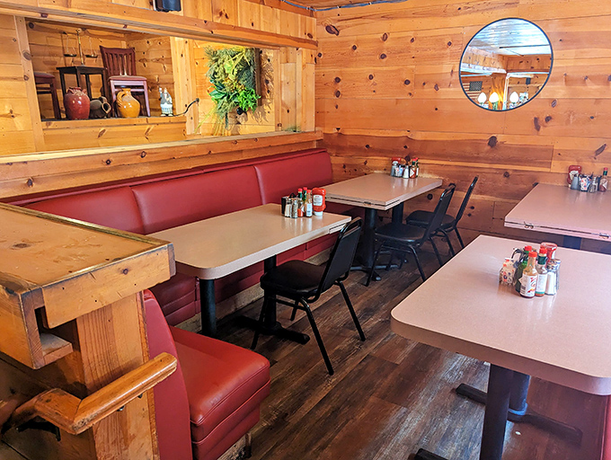 Red vinyl booths and wooden tables create the perfect stage for the daily theater of American breakfast, where coffee refills come without judgment.