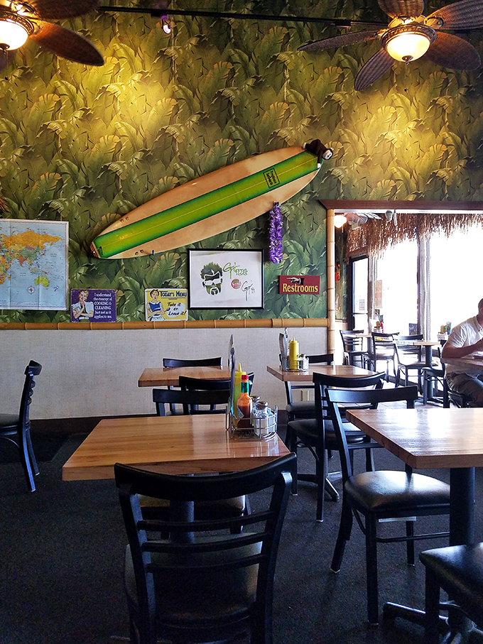 Surfboards overhead and tropical vibes everywhere create the perfect backdrop for serious burger business below.