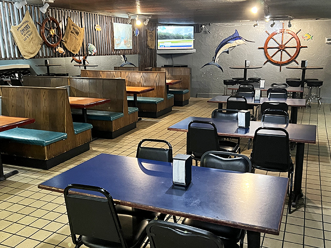 The dining area waits for the day's seafood pilgrims&mdash;wooden booths, nautical wheels, and zero pretension. Just how a real seafood joint should be.