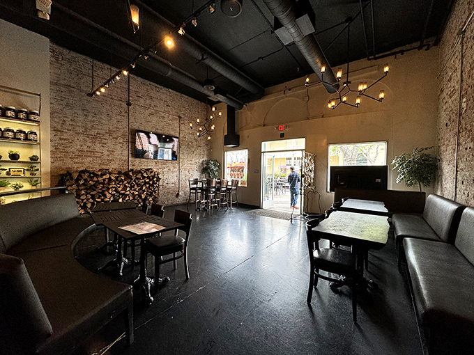 The dining area feels like the coolest friend's loft&mdash;exposed brick, moody lighting, and just enough space between tables for private pizza worship.