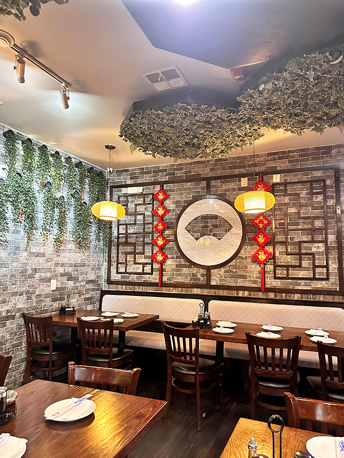 Exposed brick walls and hanging plants create an atmosphere where ancient culinary traditions meet contemporary Philadelphia dining sensibilities.