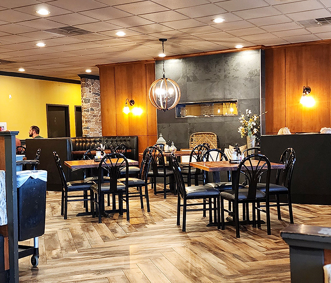 Warm lighting, stone accents, and wooden tables create that sweet spot between "nice enough for a birthday" and "comfortable enough for Tuesday."