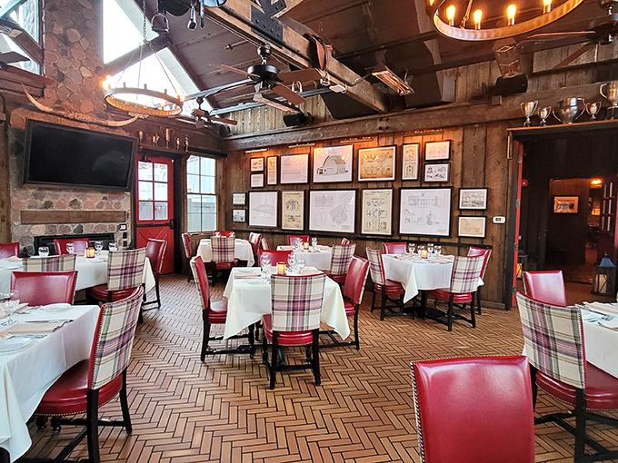 Red leather chairs and plaid accents create a dining room that feels like a Scottish hunting lodge that went to culinary school.
