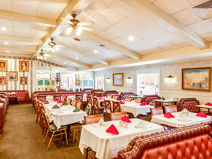 The dining room waits expectantly, each table dressed in white linen and red napkins—ready for the evening's delicious performance.