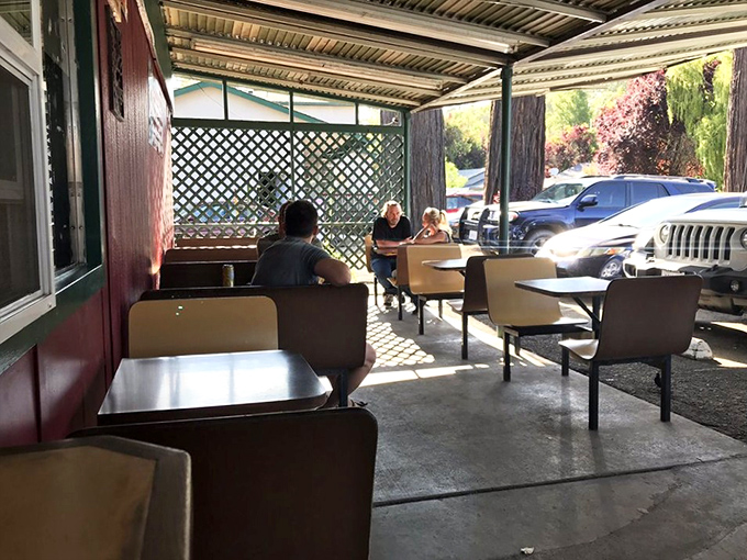 Simple tables, extraordinary food. This outdoor dining area has witnessed more food euphoria than a cooking show highlight reel.
