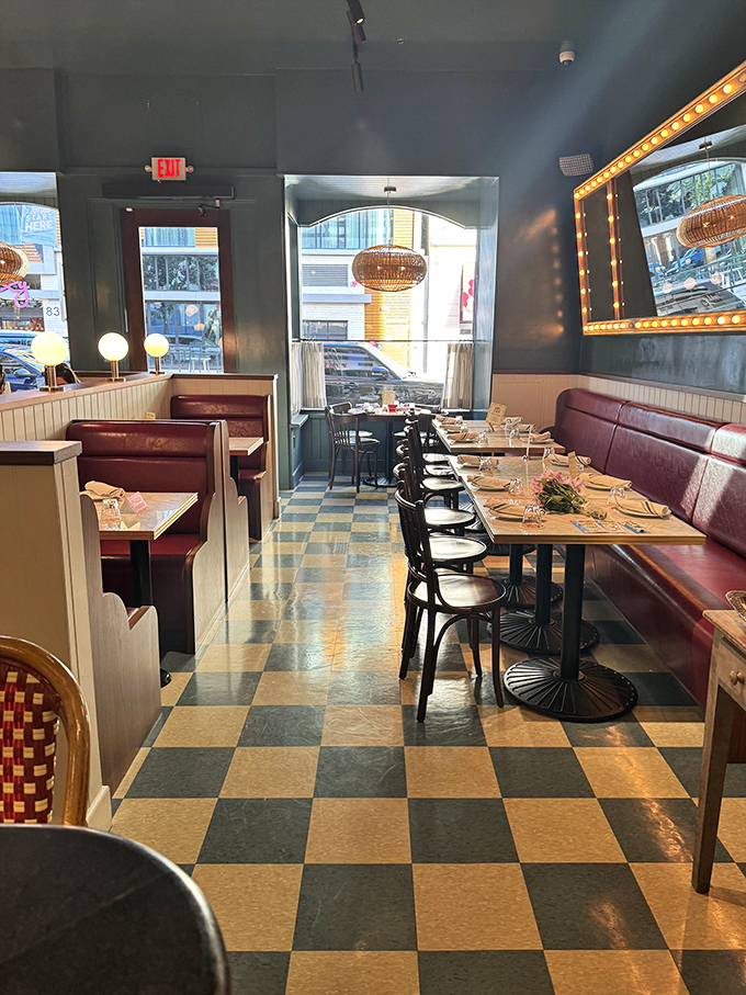 The checkerboard floor and burgundy banquettes aren't retro—they're timeless, like the perfect pair of jeans or a Beatles album.