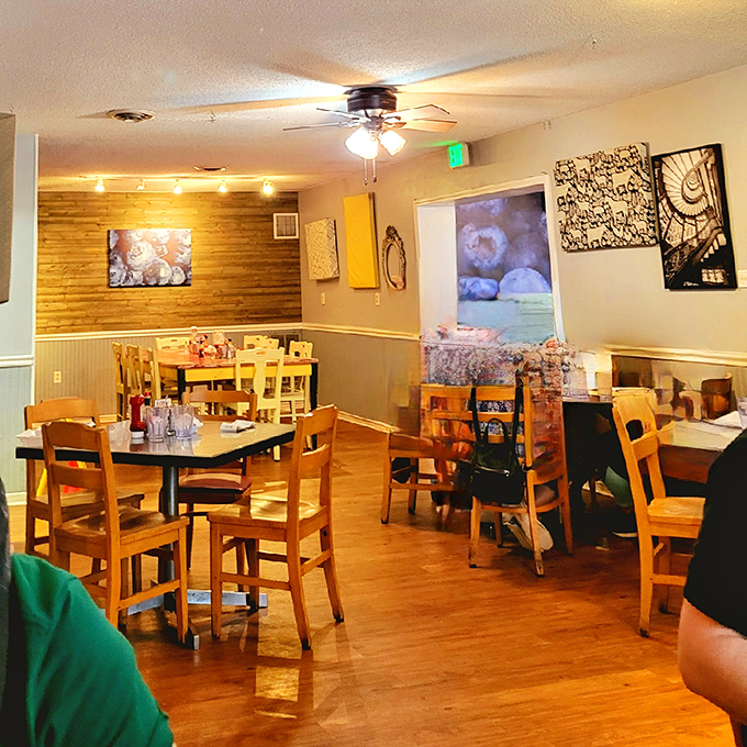 Wooden tables, warm lighting, and the promise of good food. This dining area has seen countless morning conversations and coffee refills.