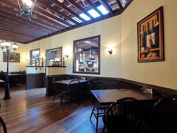 Dining rooms should tell stories – this one speaks of history with its wooden floors, cream walls, and carefully curated artwork.
