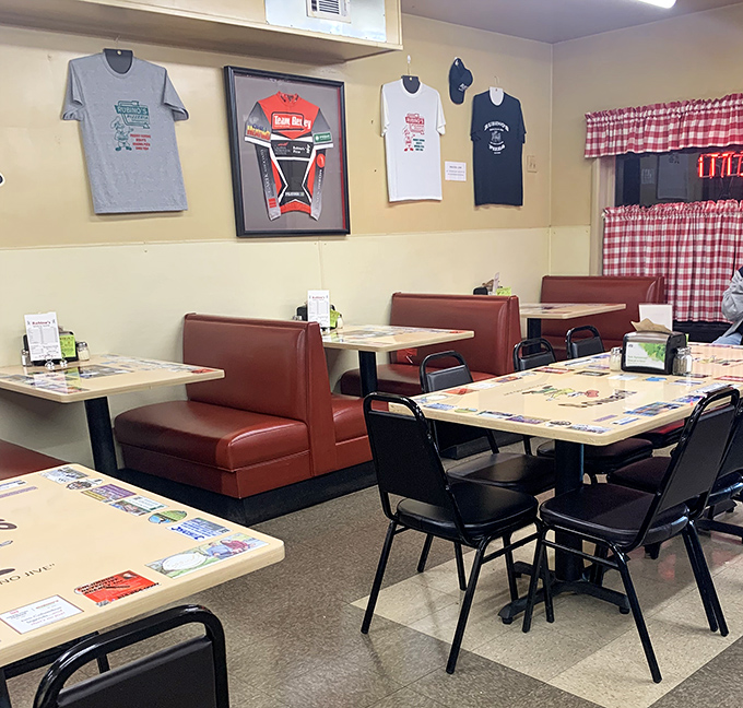 Red vinyl booths worn smooth by decades of satisfied customers, under walls adorned with memorabilia that tells stories the menu doesn't need to.