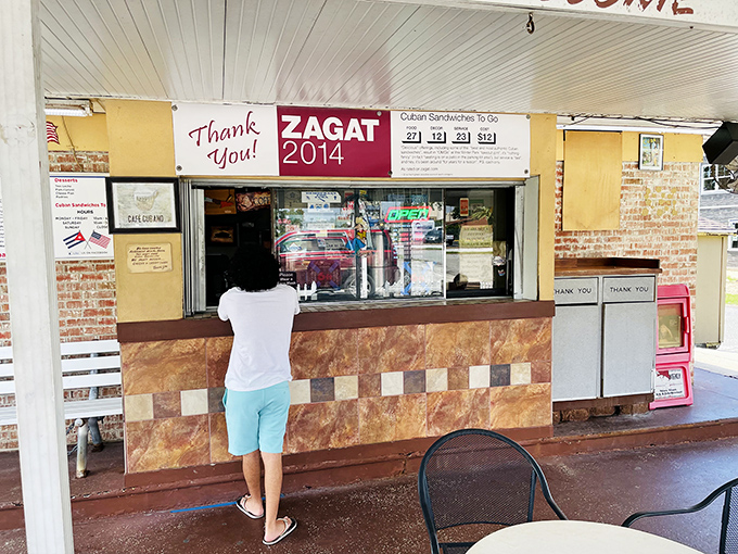The ordering window, adorned with a Zagat recognition, speaks volumes about this unassuming spot's reputation among those in the know.