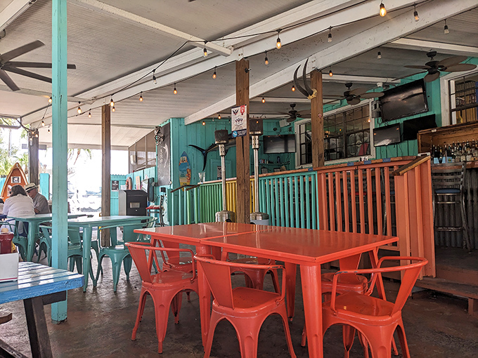Colorful chairs that match the vibrant food. This isn't interior design &ndash; it's a mood declaration that says "serious food, zero stuffiness."