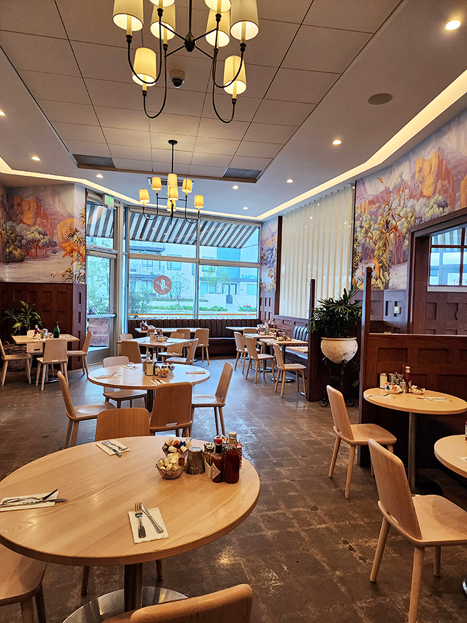 Where strangers become neighbors over plates of eggs. The mural adds California dreaming to your morning caffeine routine.