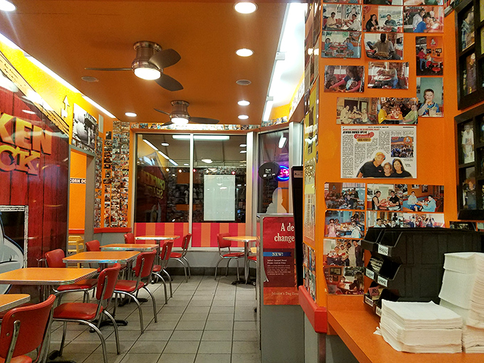 The walls tell stories of satisfied customers past while the orange and red d&eacute;cor practically shouts, "Good times happening here!"