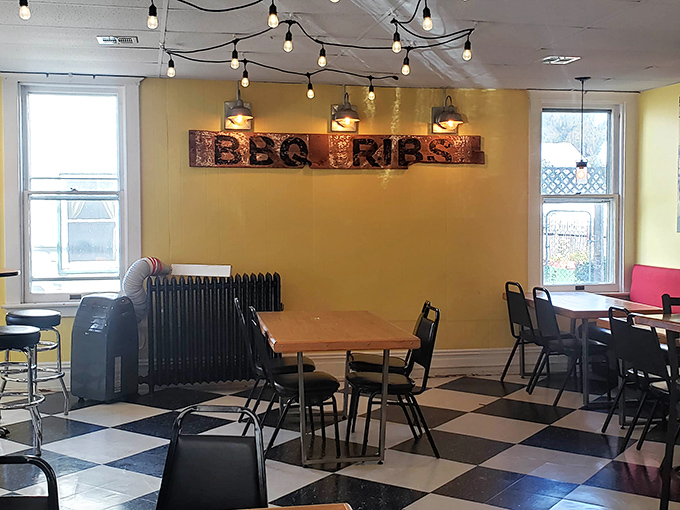 This dining room whispers "stay awhile" with every carefully chosen detail and welcoming golden wall.