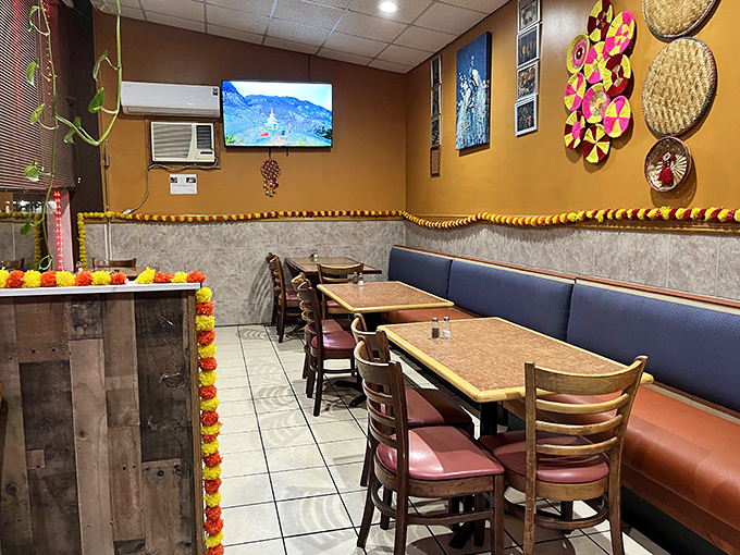 The dining area balances simplicity with touches of South Asian decor—a space that says, "We saved all our creativity for the kitchen."