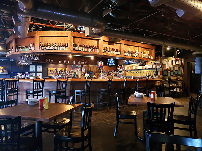 The dining area strikes that perfect balance between "nice enough for date night" and "comfortable enough to linger over that last beer."