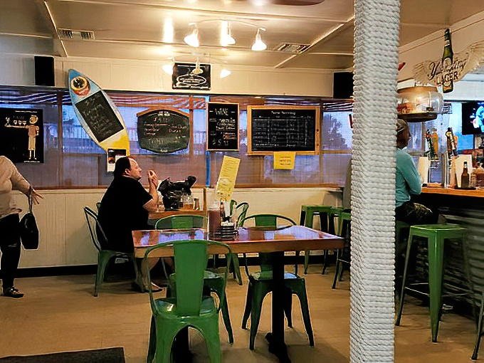 Green metal chairs and nautical touches create that perfect "I discovered this place before it was famous" vibe that food travelers live for.