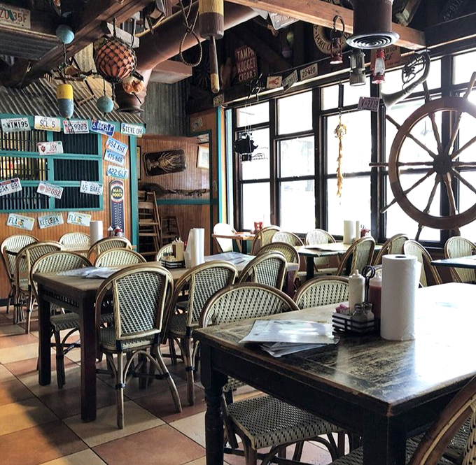 License plates and fishing nets overhead &ndash; because nothing says "authentic seafood joint" like decor that could have washed ashore after a storm.
