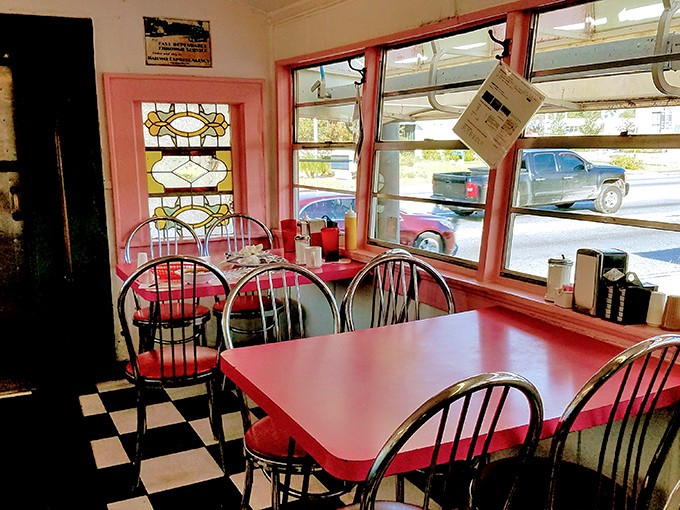 Red tables, chrome chairs, and a checkered floor&mdash;the holy trinity of classic diner design. Stained glass windows add unexpected elegance.