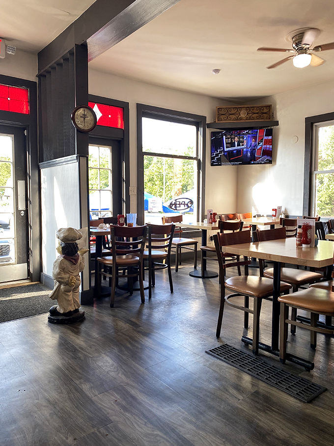 Wooden tables, natural light, and a chef statue standing guard&mdash;this dining room feels like the living room of your coolest friend.