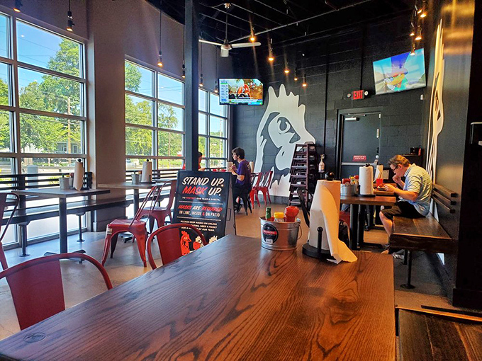 Chicken silhouettes watch over diners like guardian angels of spice in this light-filled space where chicken dreams come true.