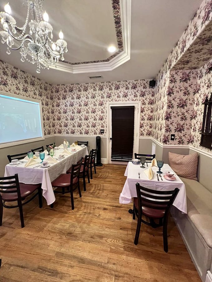 Floral wallpaper, crystal chandeliers, and tables set for tea—this room has hosted more pinky-raising than a royal garden party.