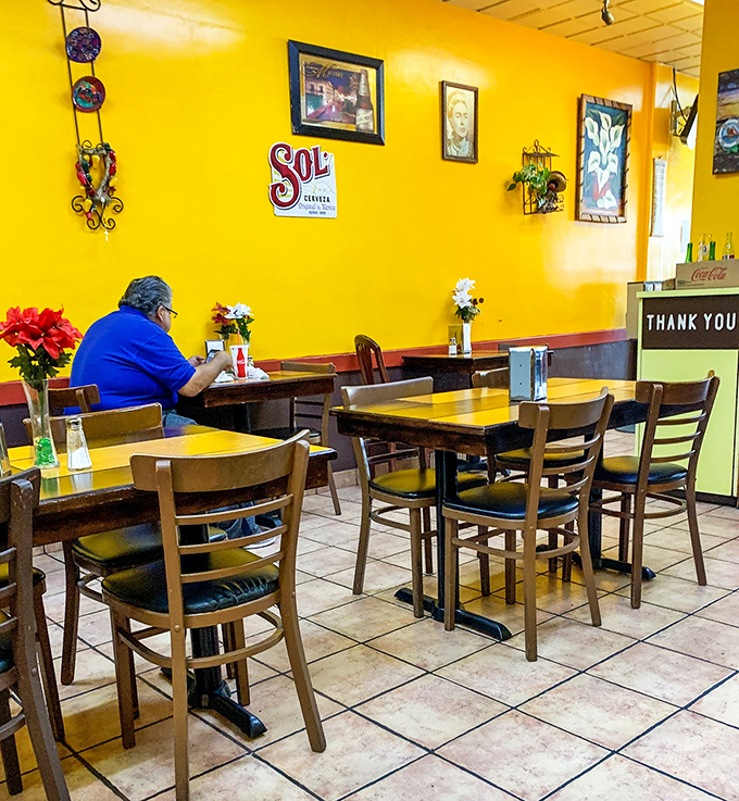 Simple tables and chairs where locals gather to discuss life's important matters over exceptional Mexican food.