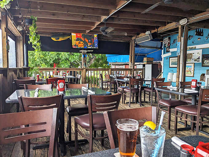 The covered dining deck offers the perfect blend of shade and scenery &ndash; because sunburn shouldn't be on the menu with your seafood