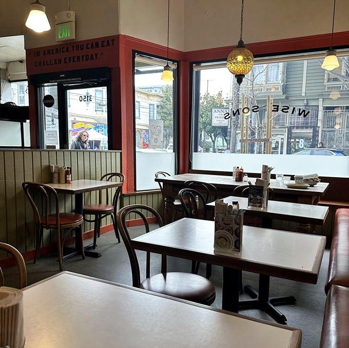 Simple tables, vintage lighting, and large windows create the perfect stage for the real star—the food. Cozy without trying too hard.