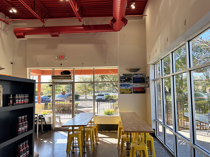 Bright dining space with yellow chairs that practically beg you to sit and savor every bite.