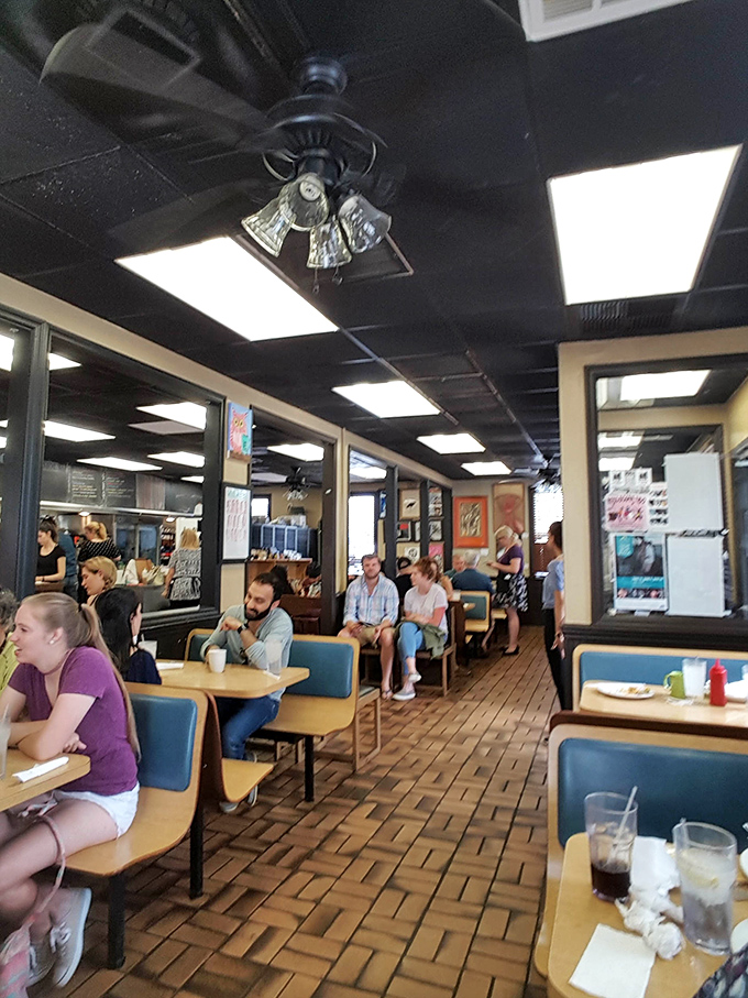A bustling dining room where strangers become neighbors. The animated conversations and satisfied smiles tell you everything you need to know about the food.