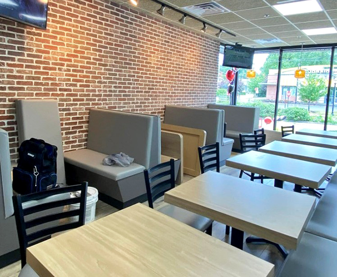 Brick walls and simple booths create the perfect backdrop for the real star of the show&mdash;whatever's about to arrive on your plate.