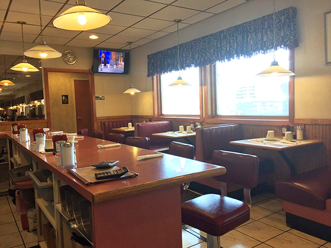 The counter seating area&mdash;where solo diners become regulars, and servers remember your coffee preferences better than your own children do.