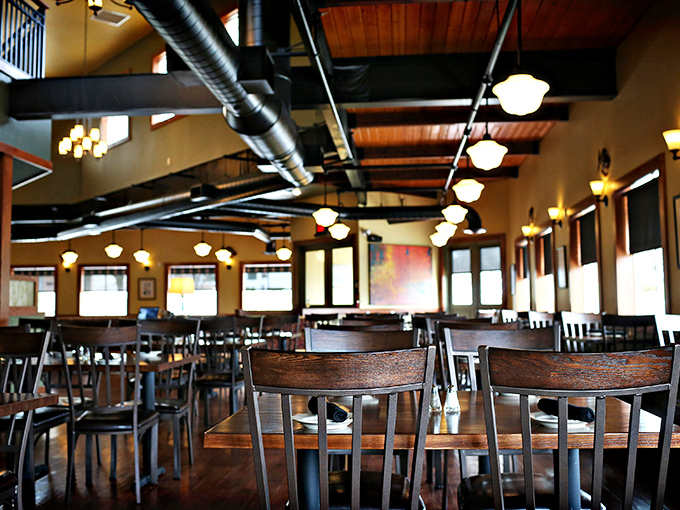 The dining room's wooden chairs and warm lighting create that rare atmosphere where both first dates and anniversary dinners feel equally at home.