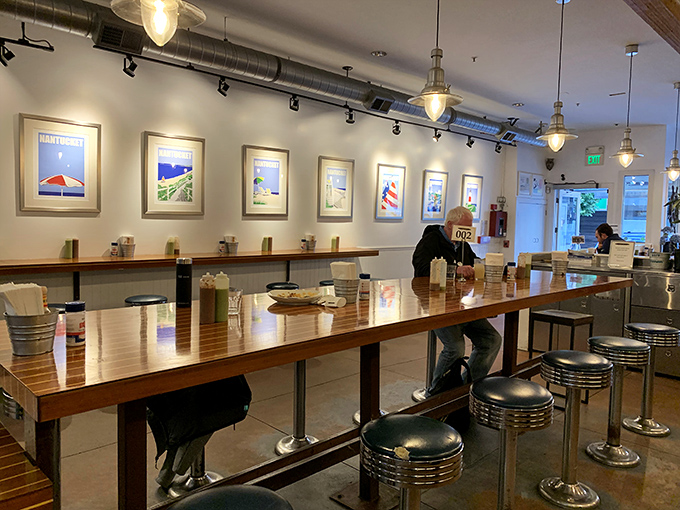 The long communal counter invites strangers to become friends, united by the universal language of "pass the hot sauce, please."