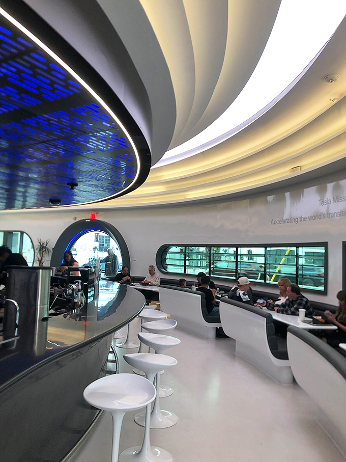 The dining area curves like the interior of a luxury spaceship where the mission is feeding hungry earthlings rather than exploring galaxies.
