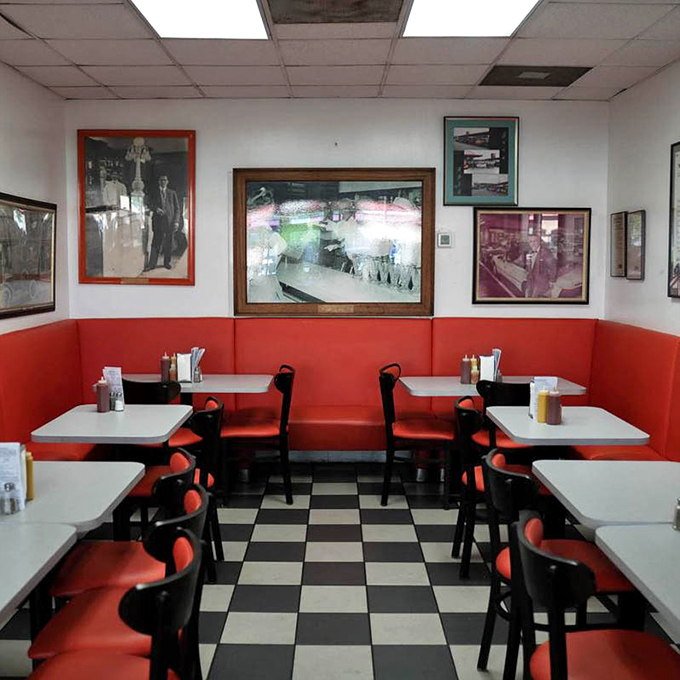 Red booths cradle diners like old friends while vintage photographs stand guard. Every table here has witnessed countless first dates, family celebrations, and everyday hunger victories.