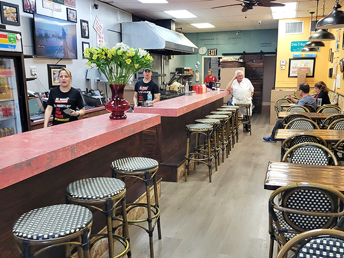 Minimalist industrial charm with maximum flavor potential. The communal tables aren't just furniture&mdash;they're friendship incubators over shared chicken experiences.