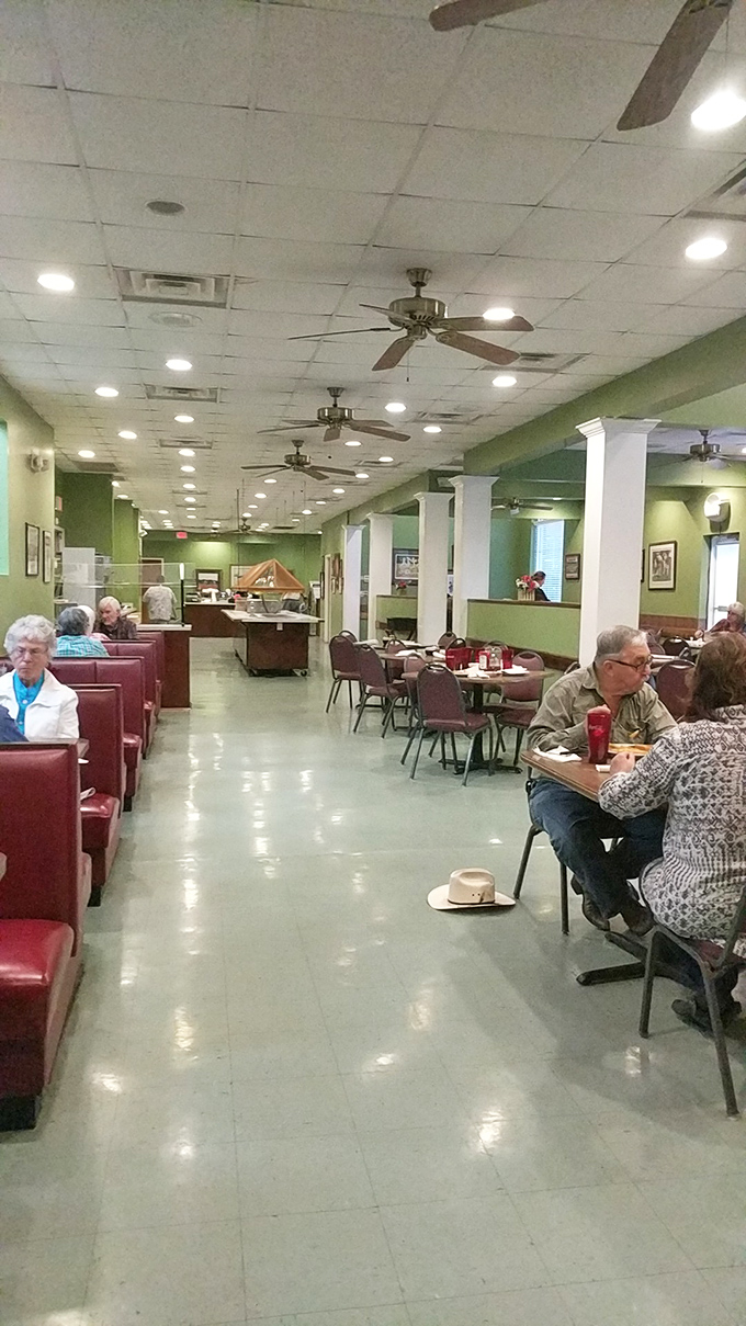 The dining room hums with conversation and ceiling fans, a symphony of Southern hospitality set to the rhythm of clinking silverware.