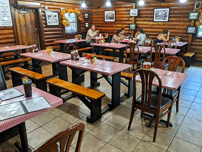 The dining room feels like a family cabin retreat. These wooden tables have witnessed countless barbecue epiphanies and sauce-stained smiles.