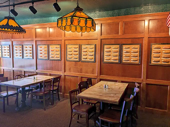 The walls tell stories here&mdash;literally. Framed hot dog buns signed by celebrities create a museum-like dining experience where history and hunger happily collide.