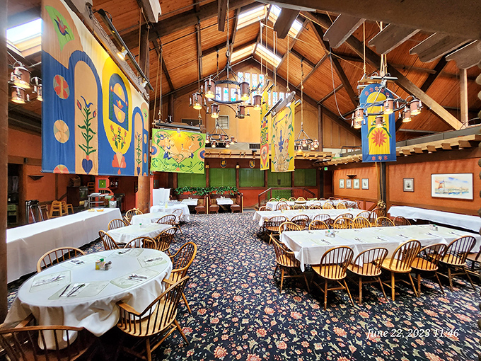 The dining room feels like stepping into a storybook, with soaring wooden beams and whimsical murals that transport you far from the California interstate.